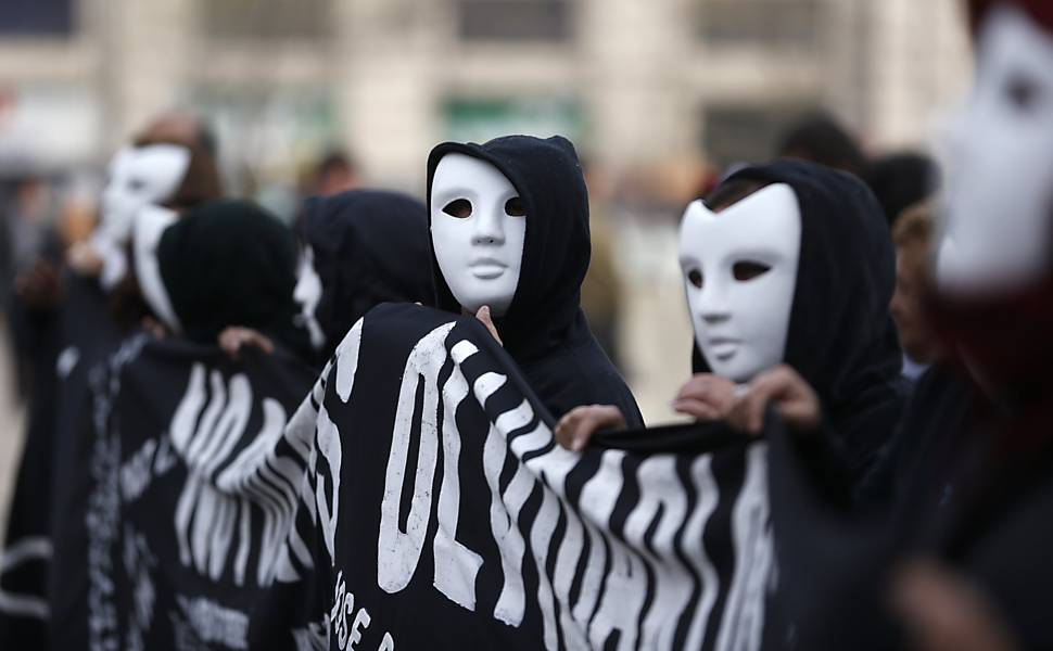 Protesters wear masks during rally marking the 39th anniversary of the ...
